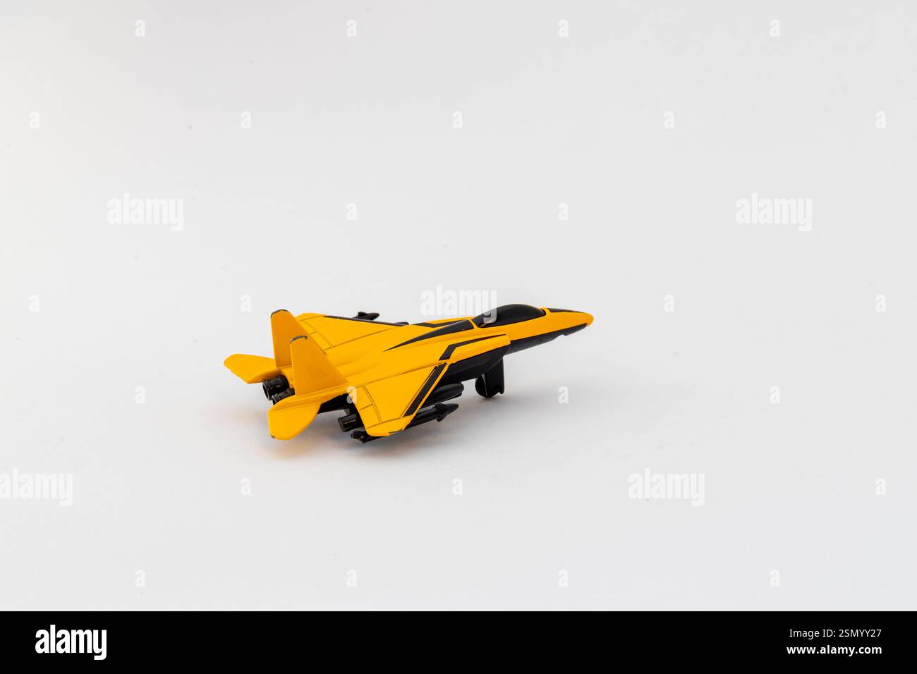 Yellow and Black Toy Jet on White Background Stock Photo - Alamy