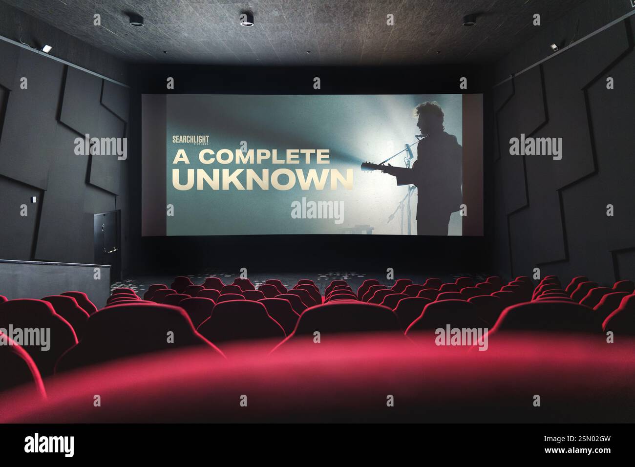Movie theater with "A Complete Unknown" film on screen. Cinema ...