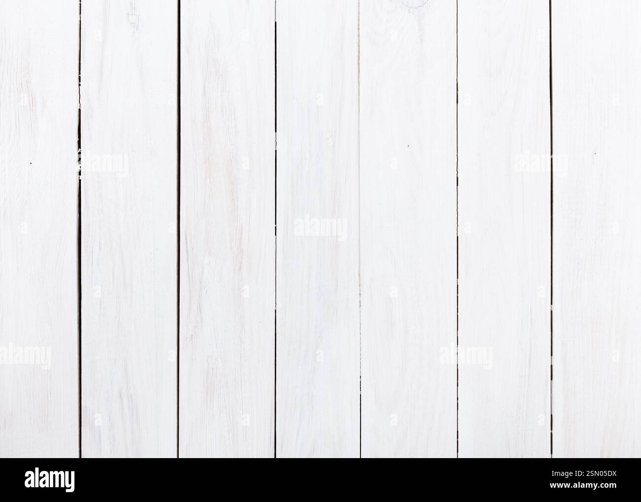 Simple white wooden planks create a clean and minimalist backdrop in a ...