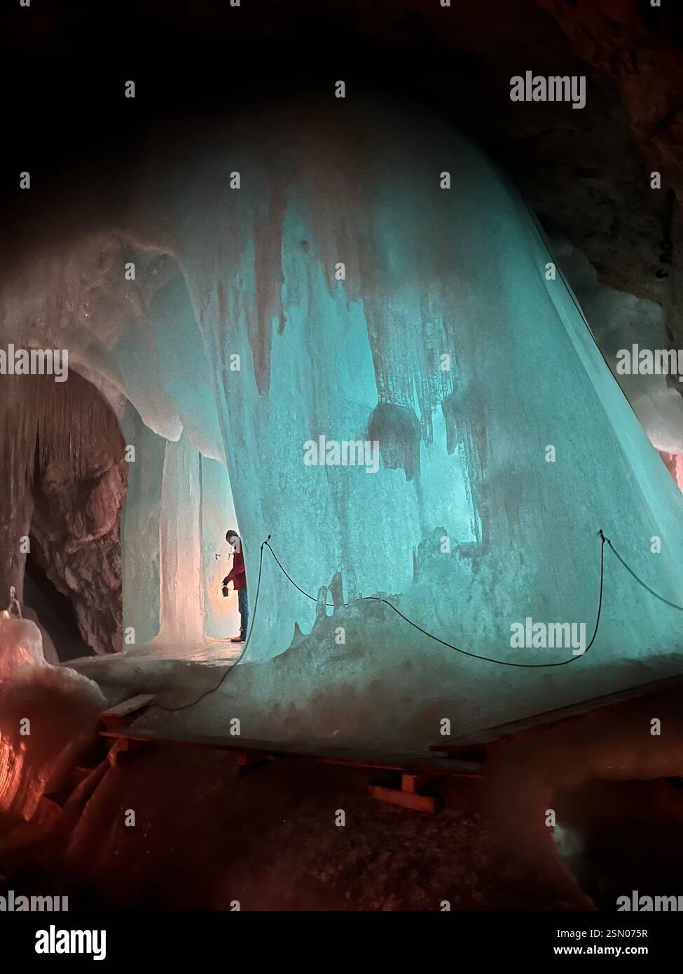 A peek into an ice cave of Austrian alps Stock Photo - Alamy