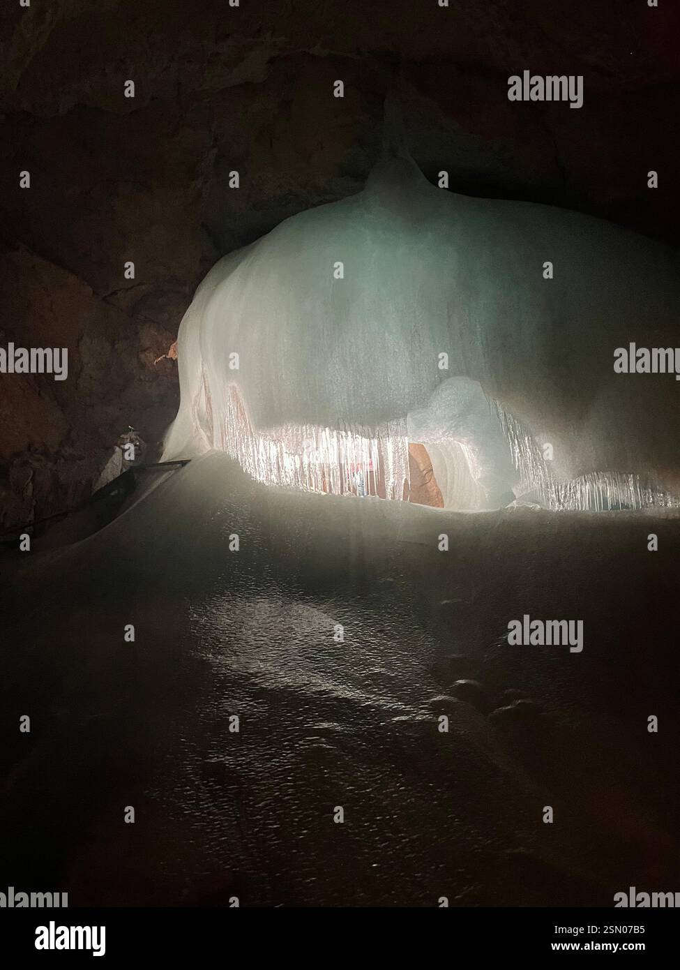 A peek into an ice cave of Austrian alps Stock Photo - Alamy