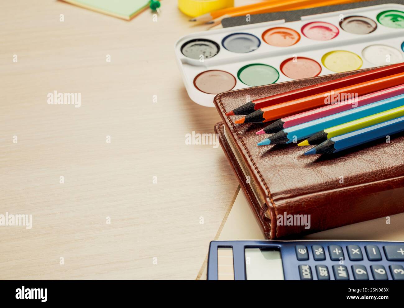 Colorful art supplies and tools arranged on a workspace ready for ...