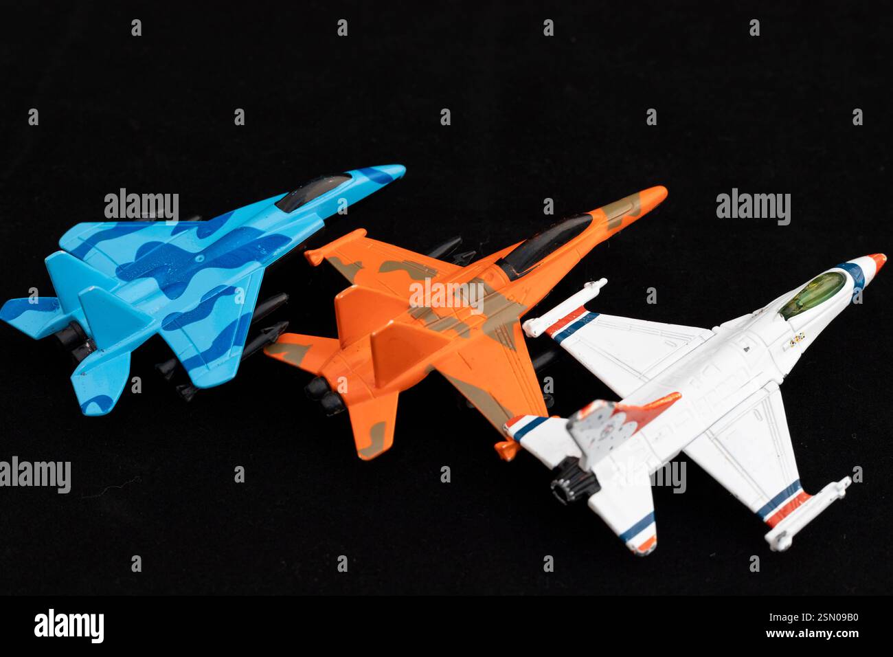 Impressive Trio of Fighter Jet Toys in White, Orange, and Blue ...