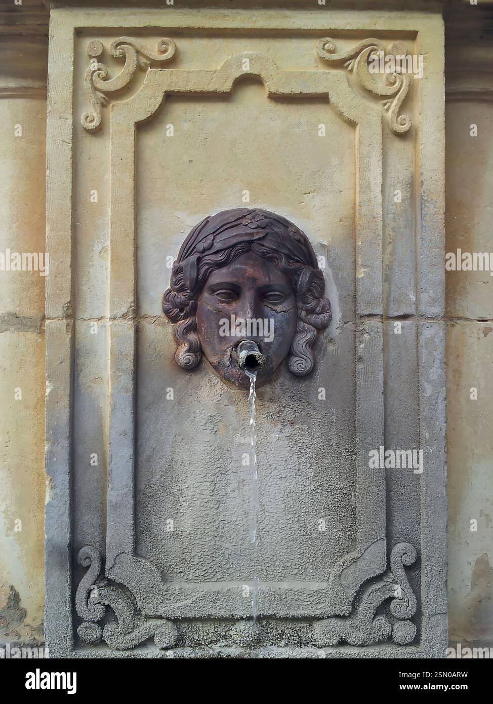 Antique Stone Fountain With Decorative Face Sculpture and Water Flowing ...