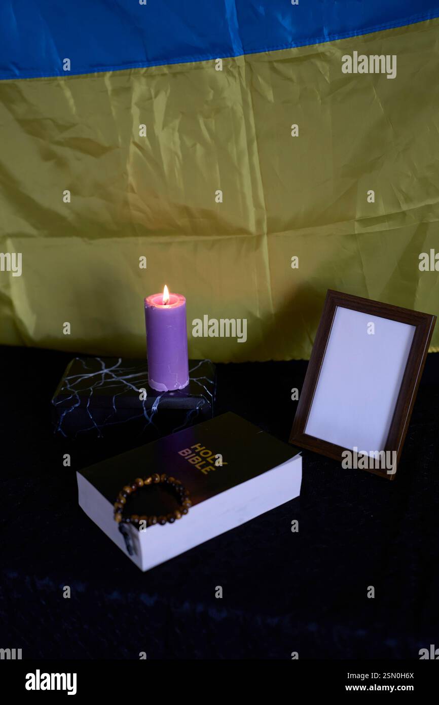 funeral of Ukrainian , photo frame, candles, marble urn for ashes, holy ...