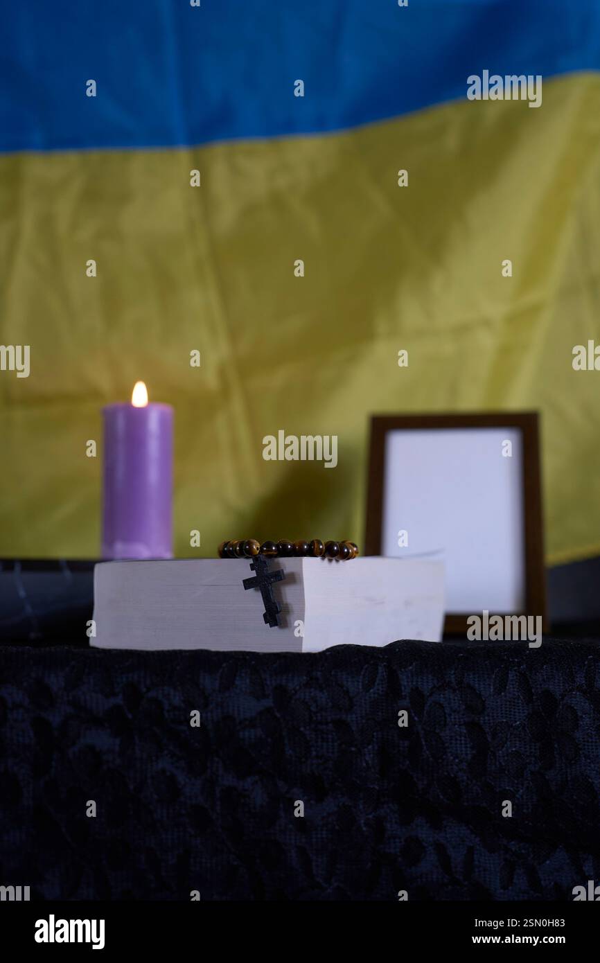funeral of Ukrainian , photo frame, candles, marble urn for ashes, holy ...