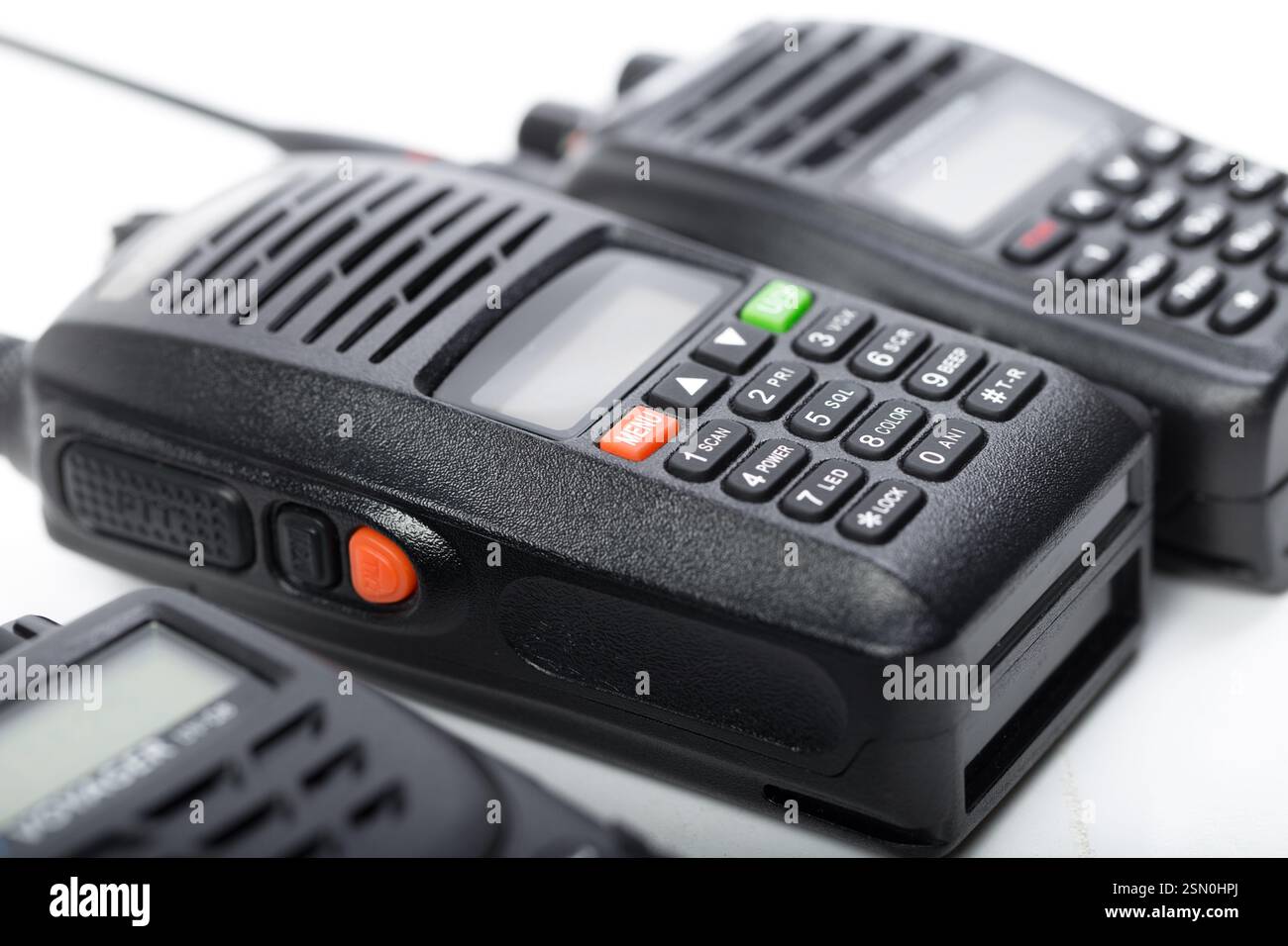 Various models of handheld communication devices on a clean surface for ...