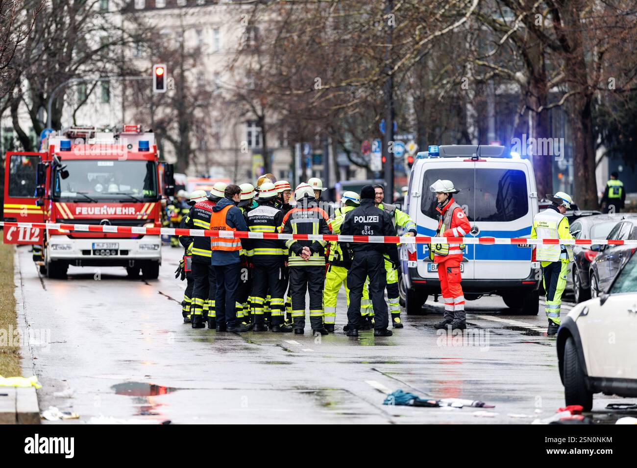 Munich, Germany. 13th Feb, 2025. Rescue workers stand at the scene not ...