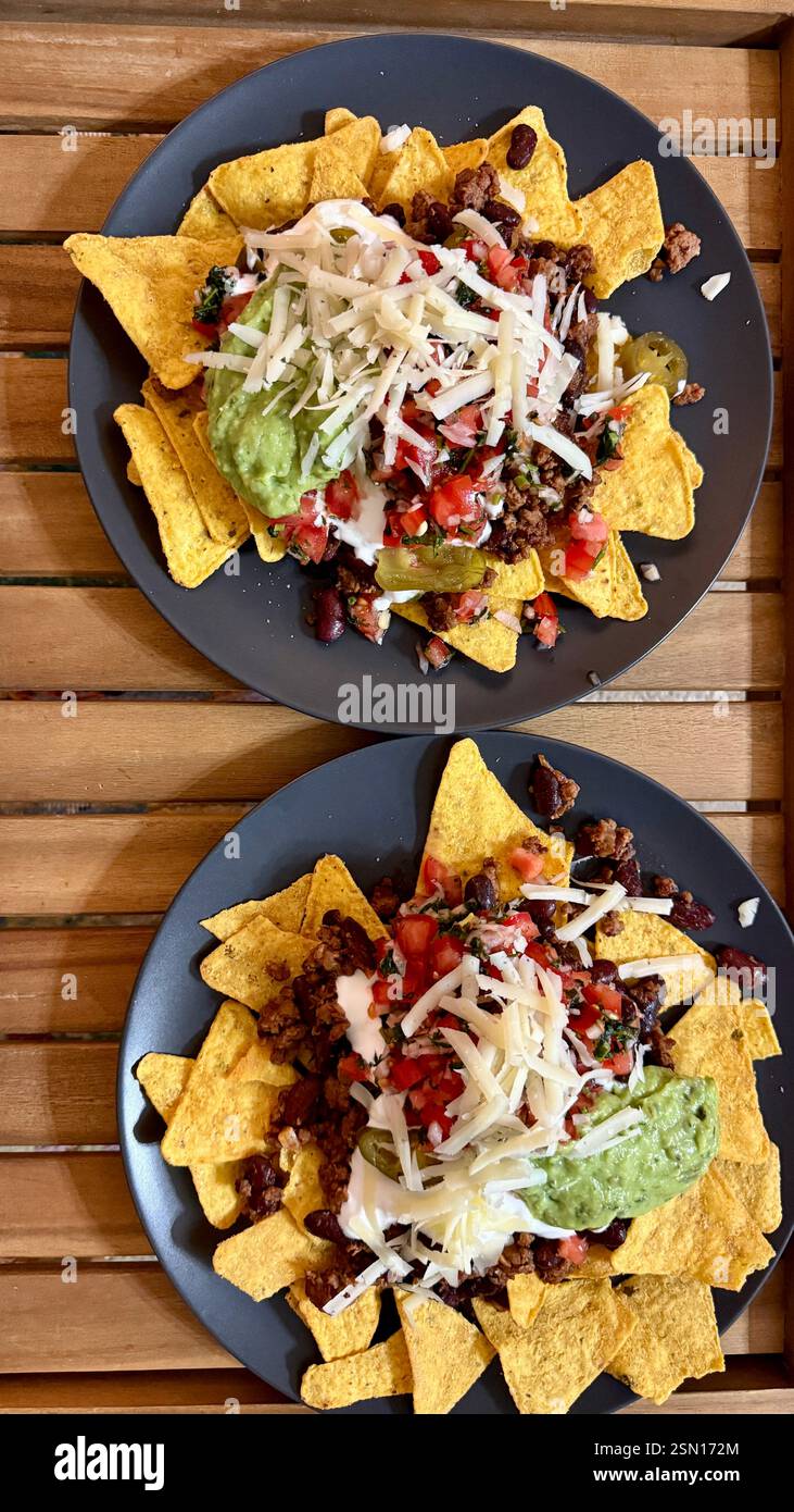 Beef nachos with multiple toppings Stock Photo - Alamy