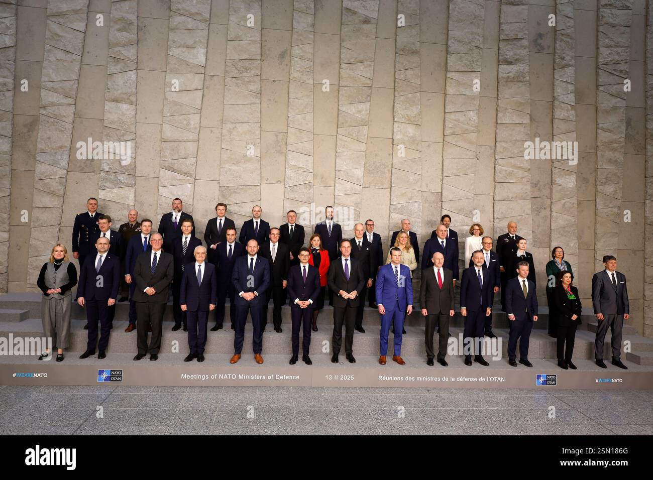 Ministers pose during a group photo of NATO defense ministers at NATO ...