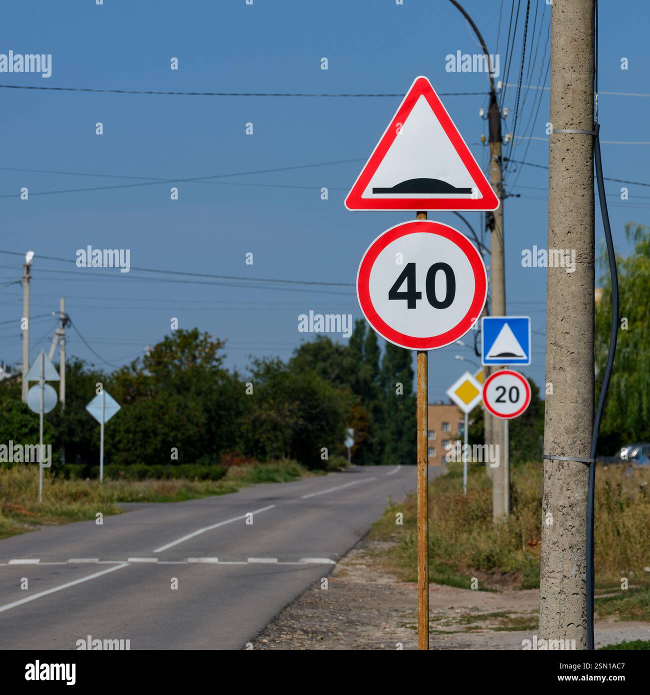 Row of road signs on city road Stock Photo - Alamy