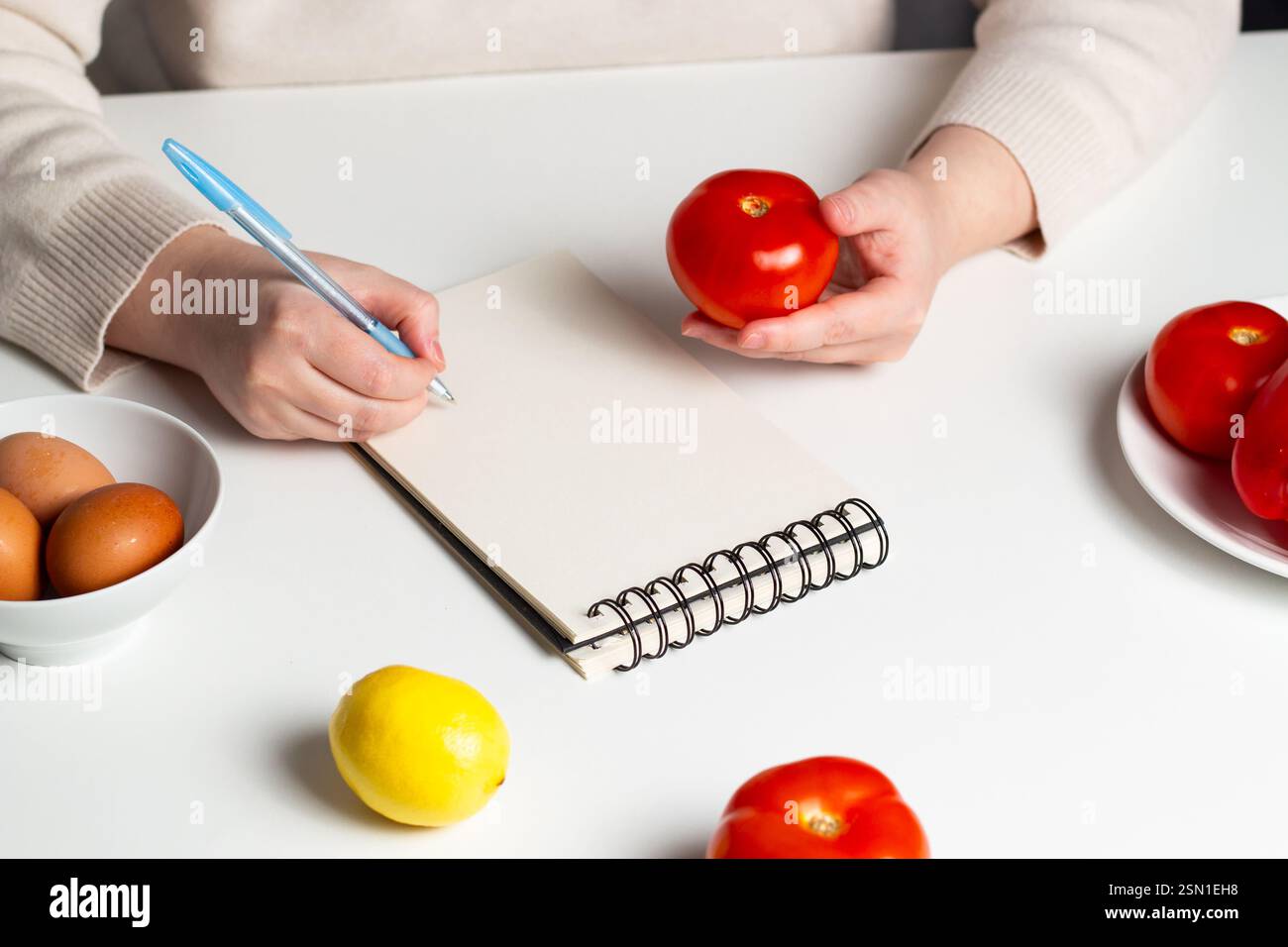 Nutritionist doctor writing down diet plan for patient. Healthy eating ...