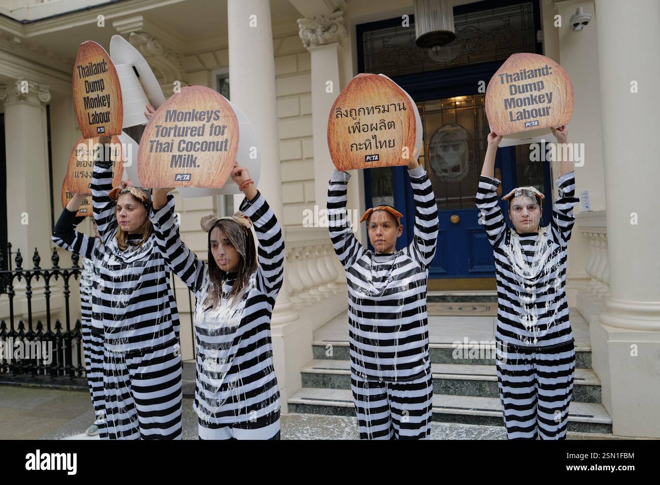 Activists from PETA stage a dramatic protest outside the Royal Thai ...