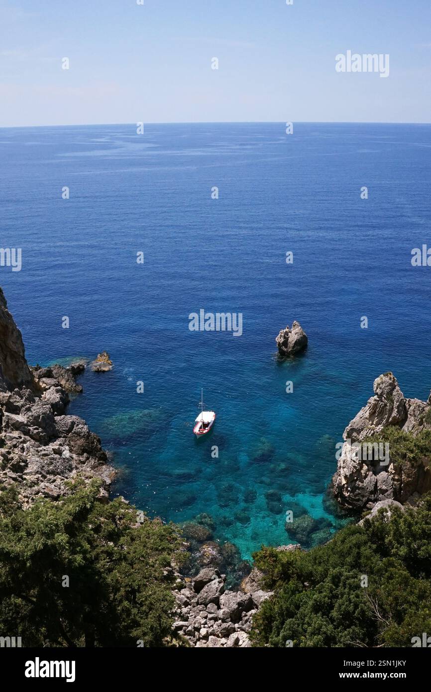 Idyllic view out to crystal blue ocean in Paleokastritsa, Corfu, Greece ...