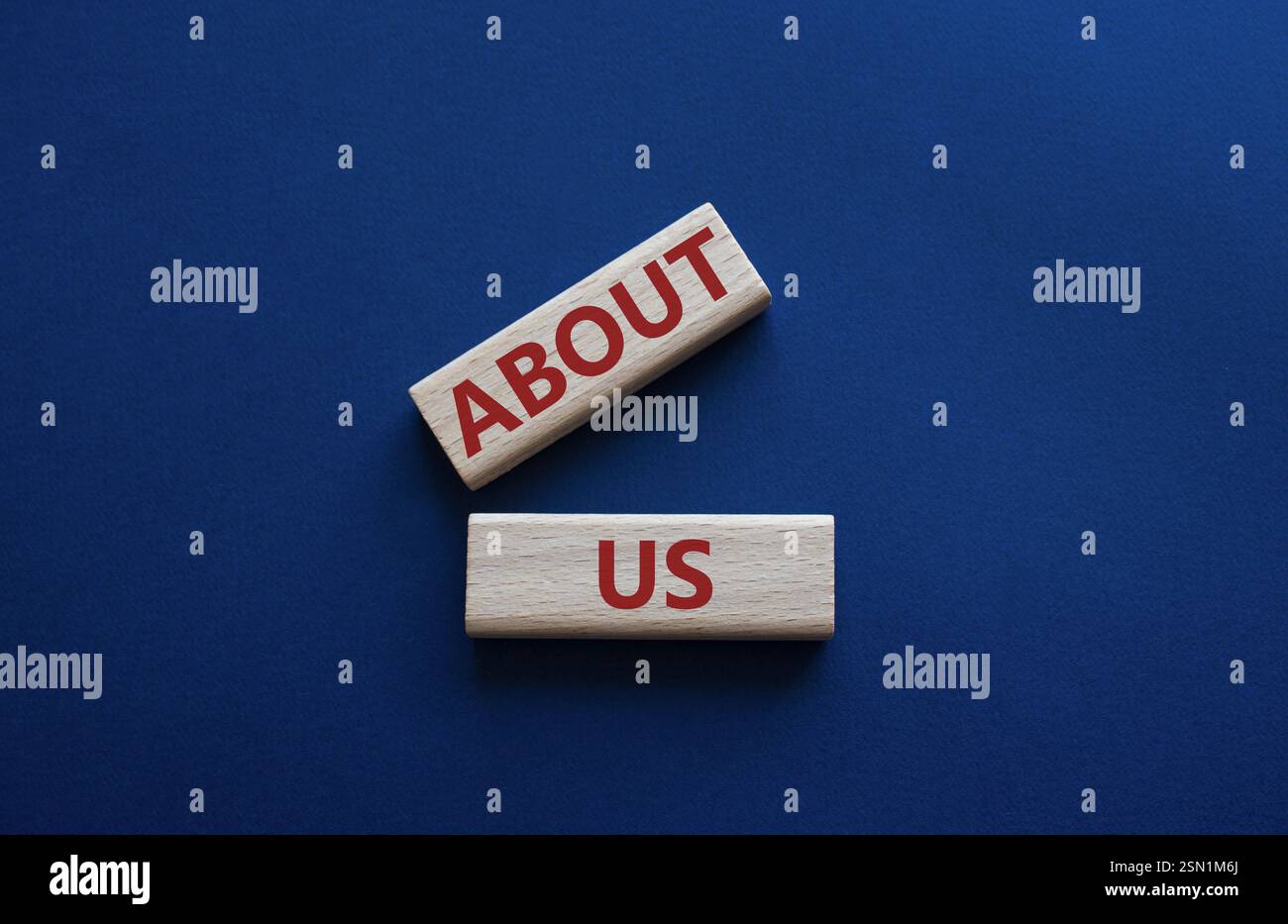 About us symbol. Wooden blocks with words About us. Beautiful deep blue ...