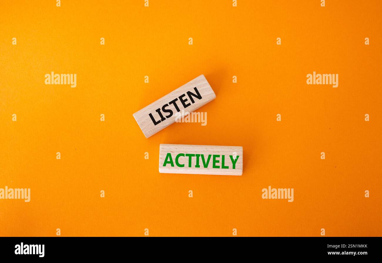 Listen actively symbol. Wooden blocks with words Listen actively ...