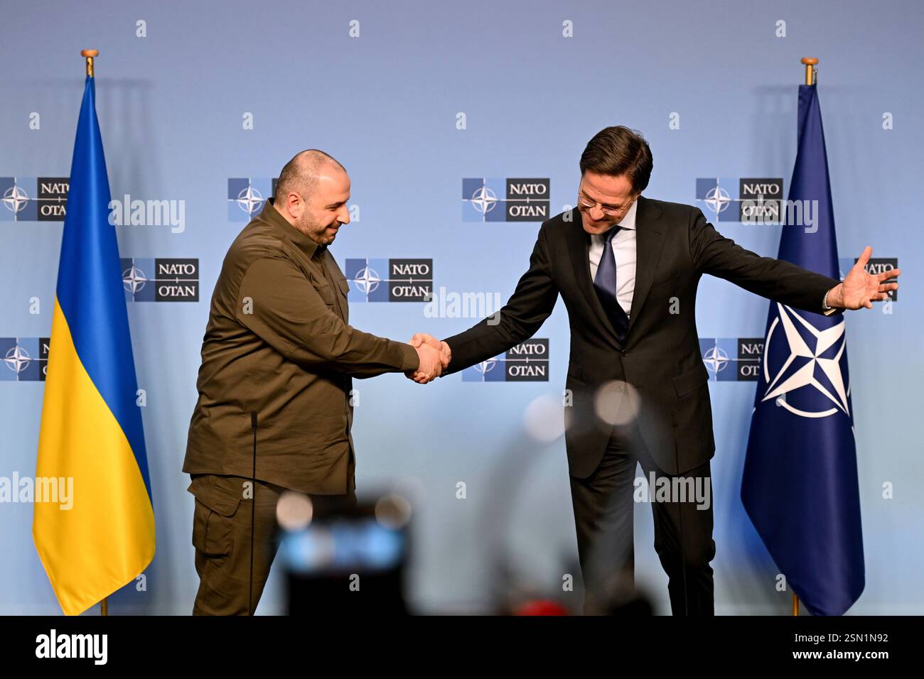 NATO Secretary General Mark Rutte, right, shakes hands with Ukraine's ...