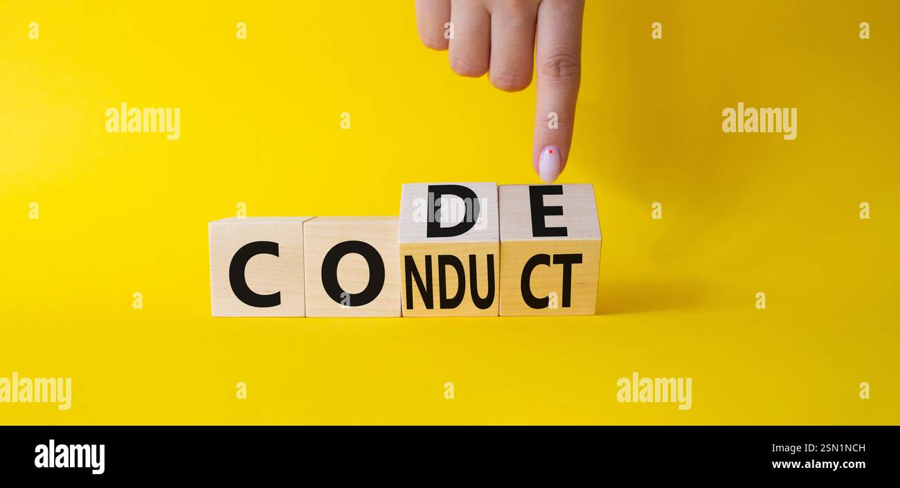 Code Of Conduct Symbol Businessman Hand Points At Cubes With Words