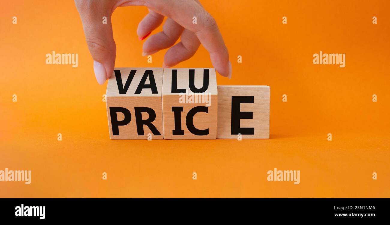Value and Price symbol. Businessman Hand turns cubes and changes word ...