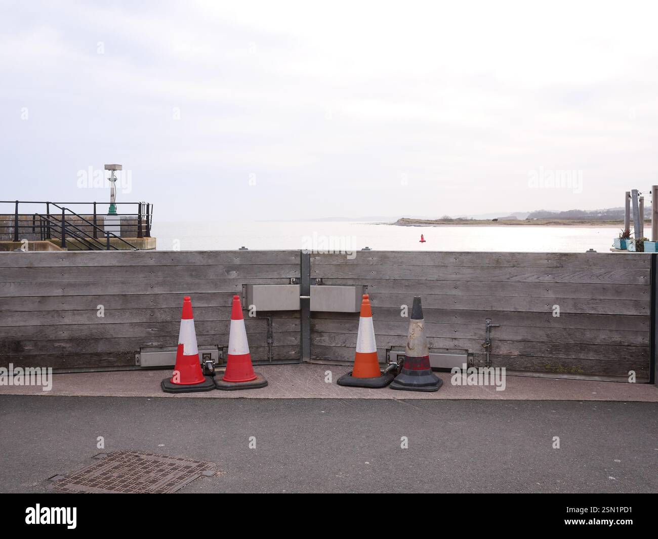 Tidal flooding defence flood gates closed across boat ramp entrance ...