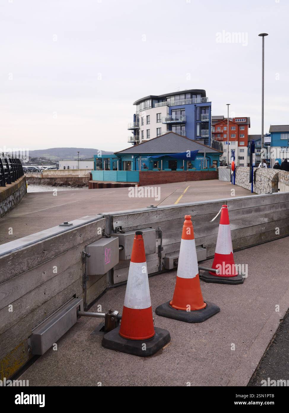Tidal flooding defence flood gates closed across boat ramp entrance ...