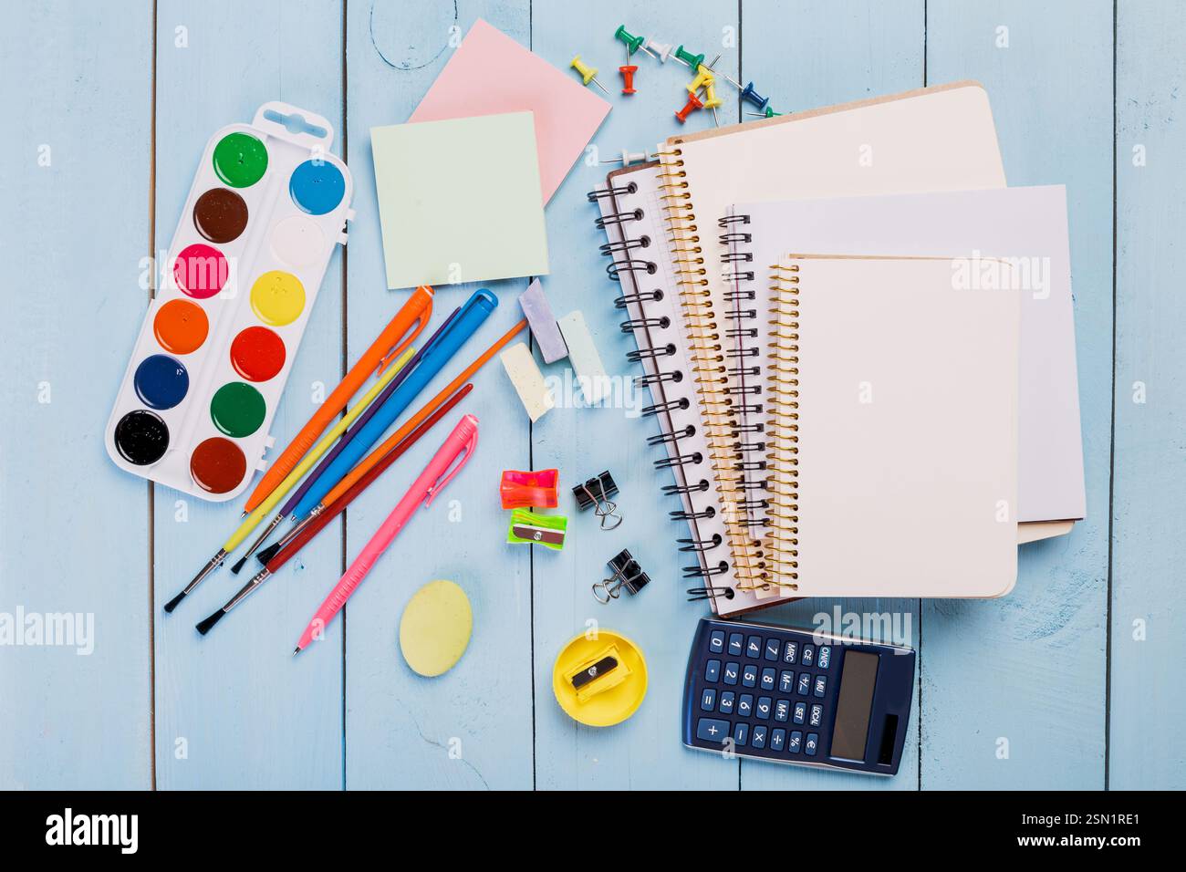 Creative workspace setup with colorful stationery and office supplies ...