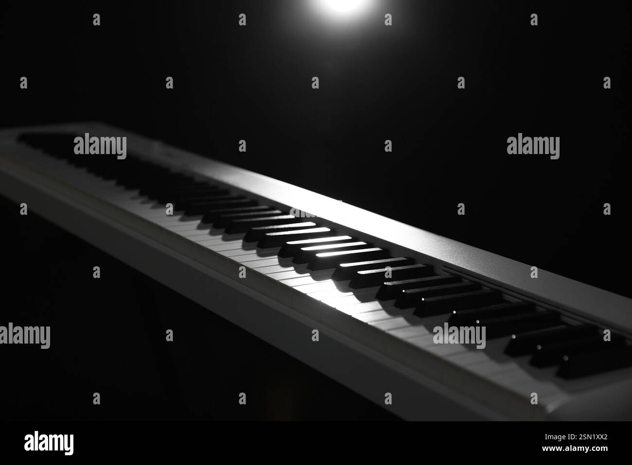 Synthesizer on black background, closeup. Electronic musical instrument ...