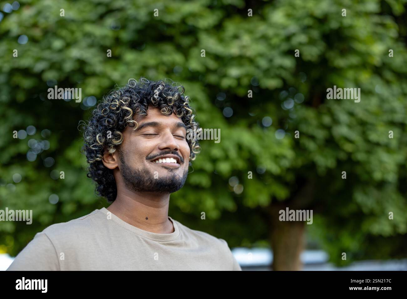Close-up of a man resting, relaxing and doing breathing exercises ...