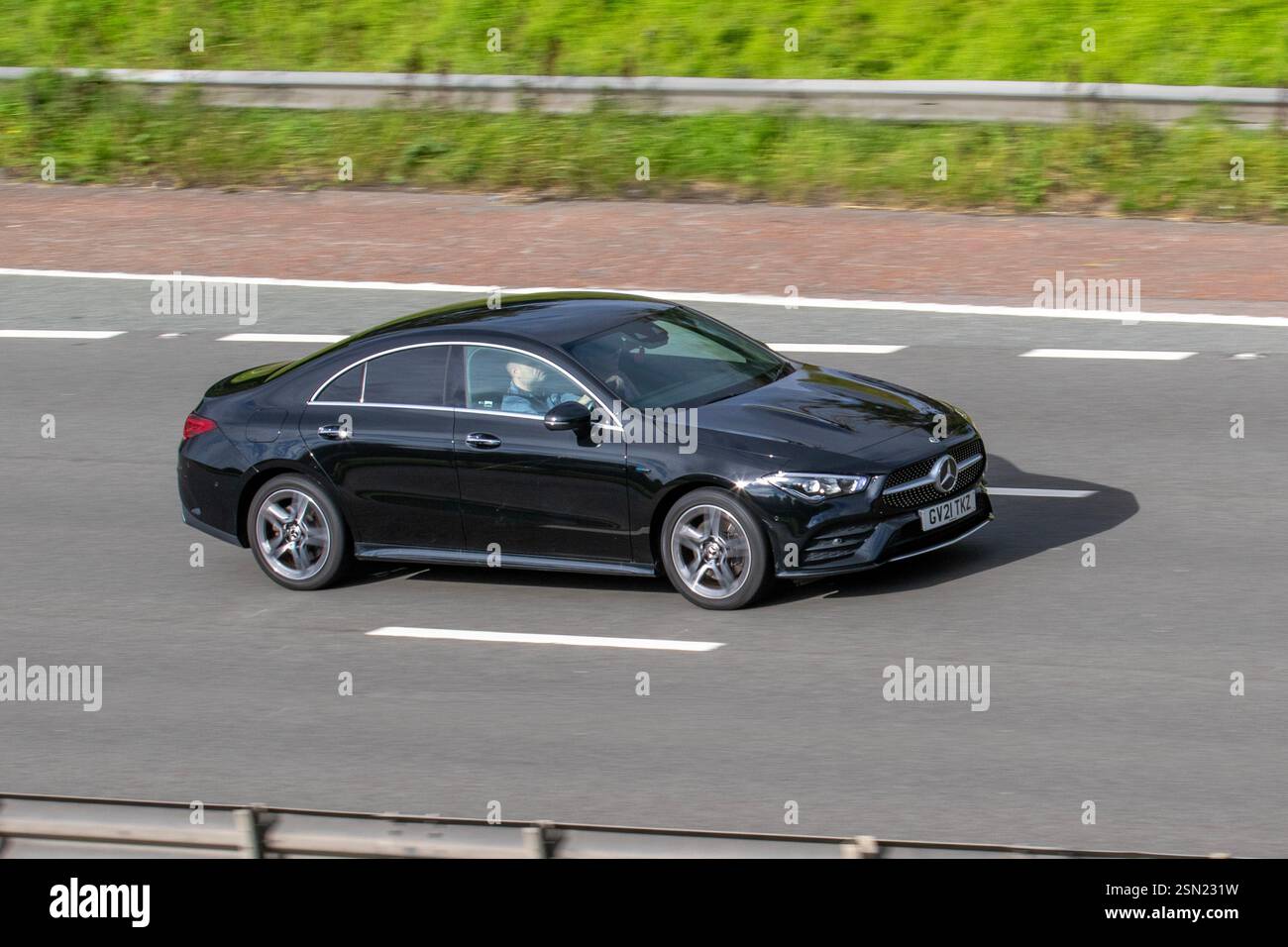 2021 Black Mercedes-Benz CLA 250 AMG Line Premium car travelling on the ...