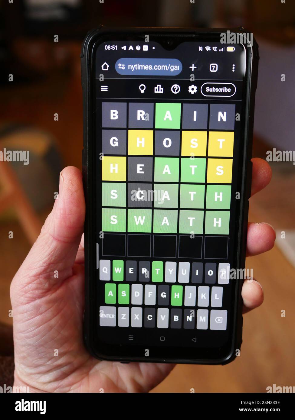 Wordle word puzzle completed online on a mobile phone screen Stock ...