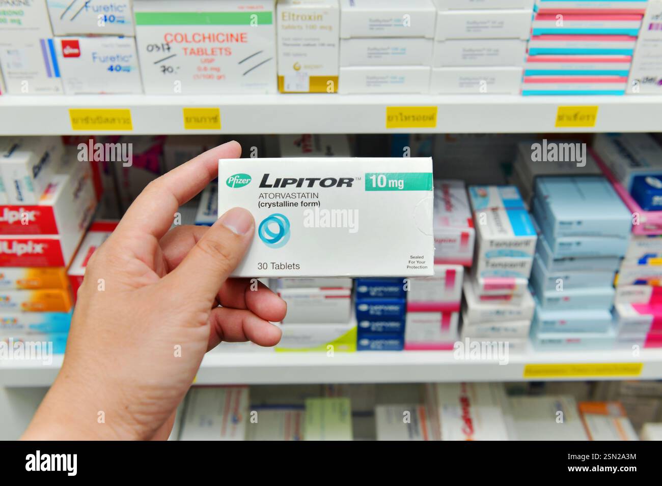 Bangkok ,Thailand - March 5, 2022 : Pharmacist holding a medicine ...