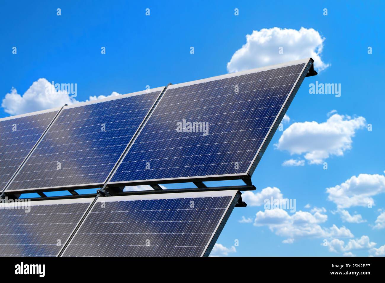 Photovoltaic solar power panels on blue sky. Alternative power energy ...