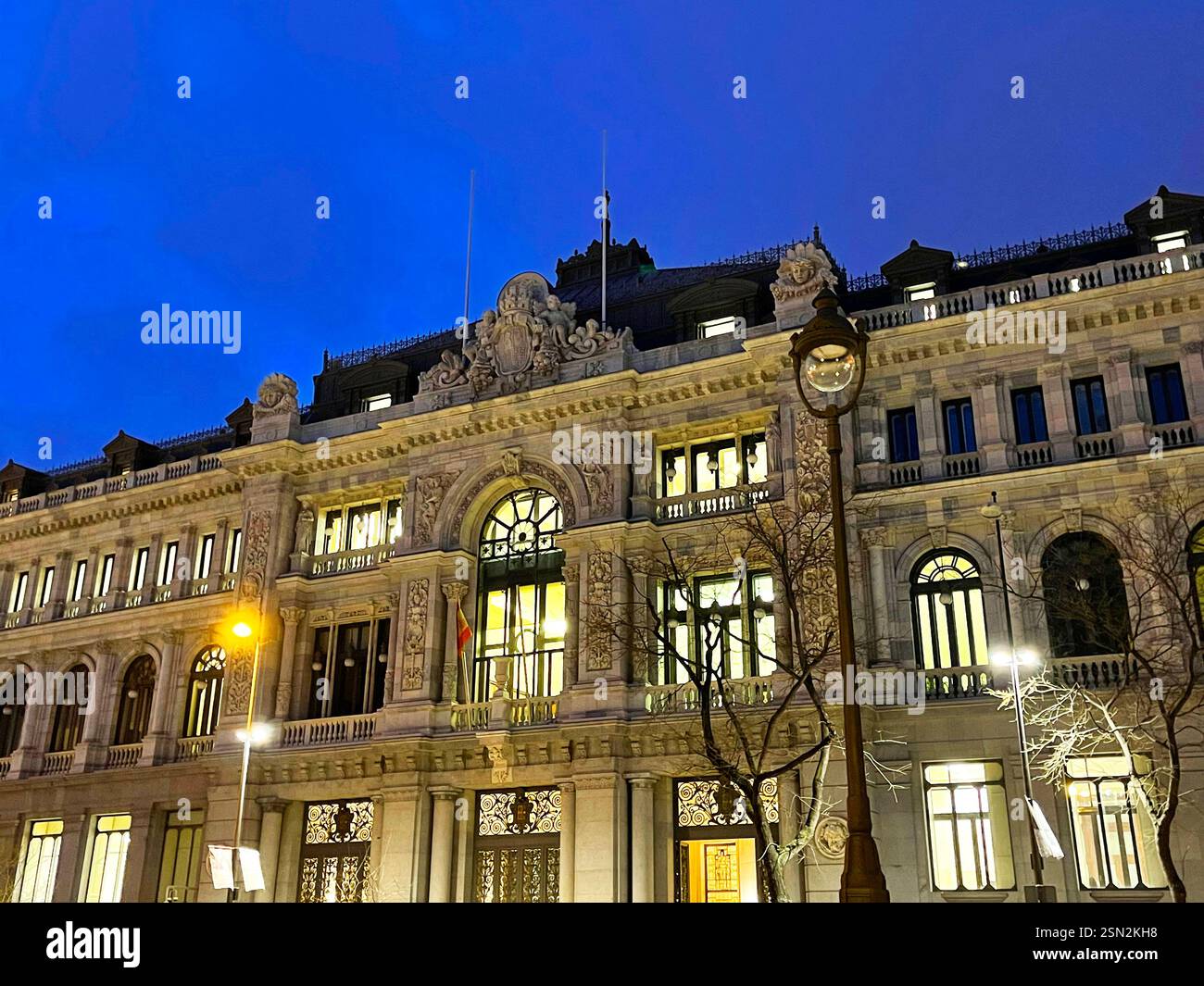 Facade of Banco de España building, night view. Alcala street, Madrid ...