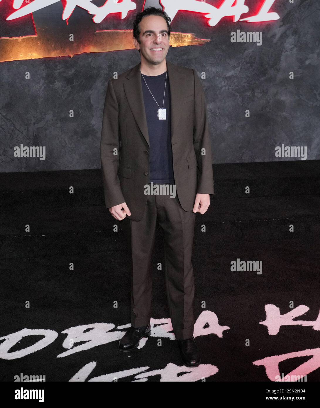 Los Angeles, USA. 12th Feb, 2025. Dan Ahdoot arrives at Netflix's COBRA ...