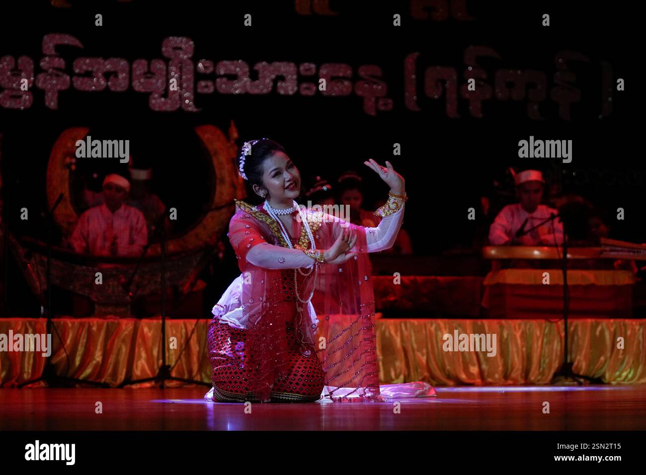 A Mon tribe's artist performs a traditional dance during a ceremony to ...