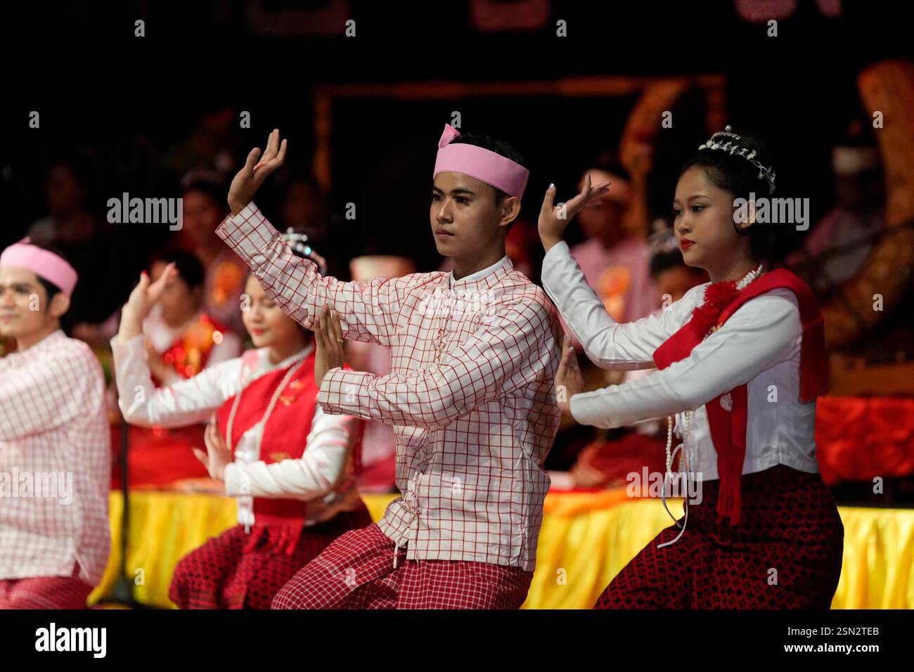 Members of the Mon tribe's artist troupe perform a traditional dance ...