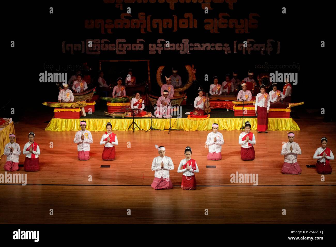 Members of the Mon tribe's artist troupe perform a traditional dance ...