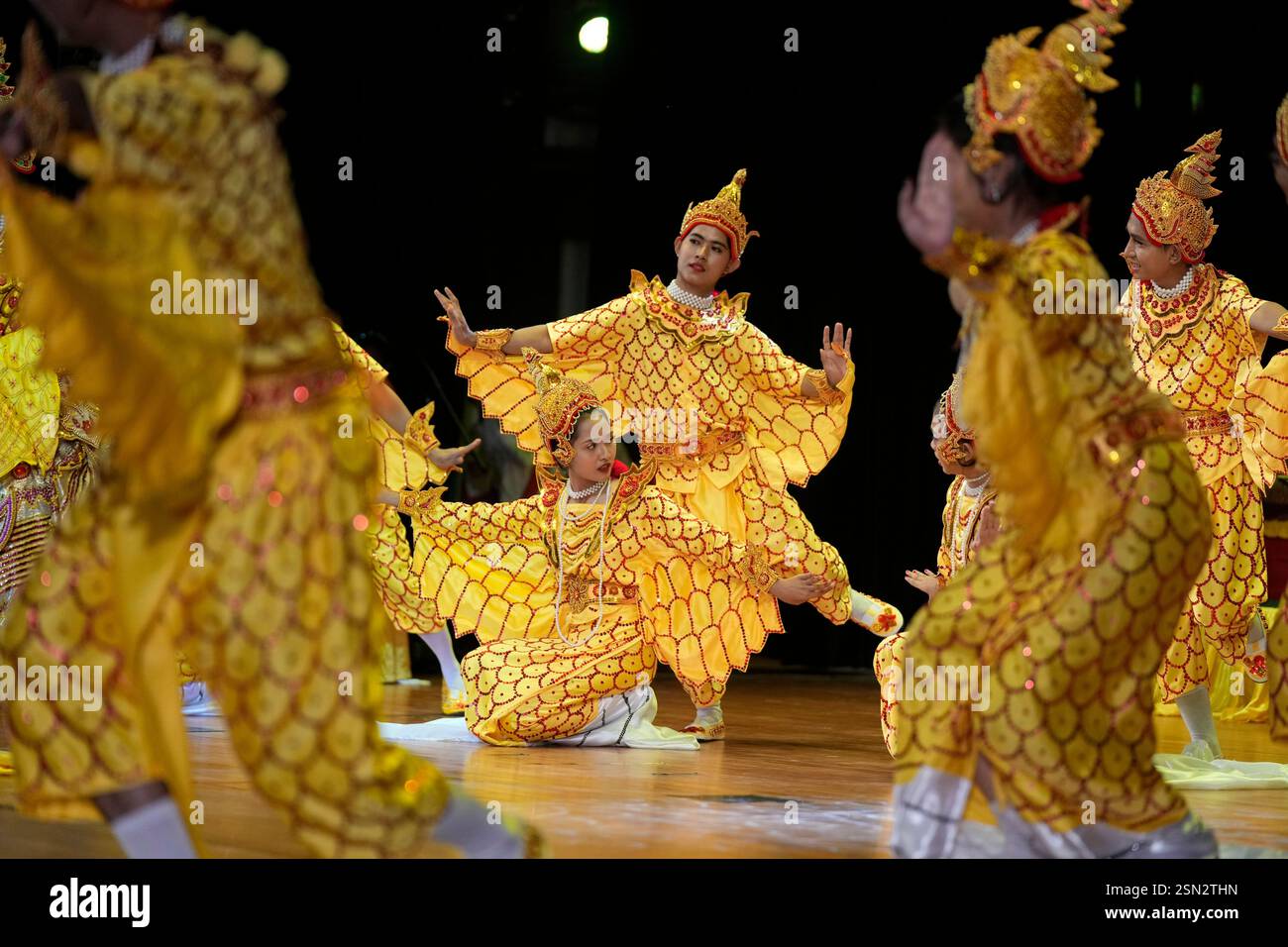 Members of the Mon tribe's artist troupe perform a traditional dance ...