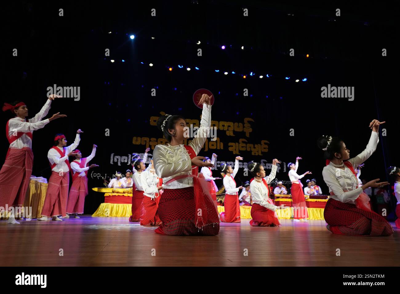 Members of the Mon tribe's artist troupe perform a traditional dance ...