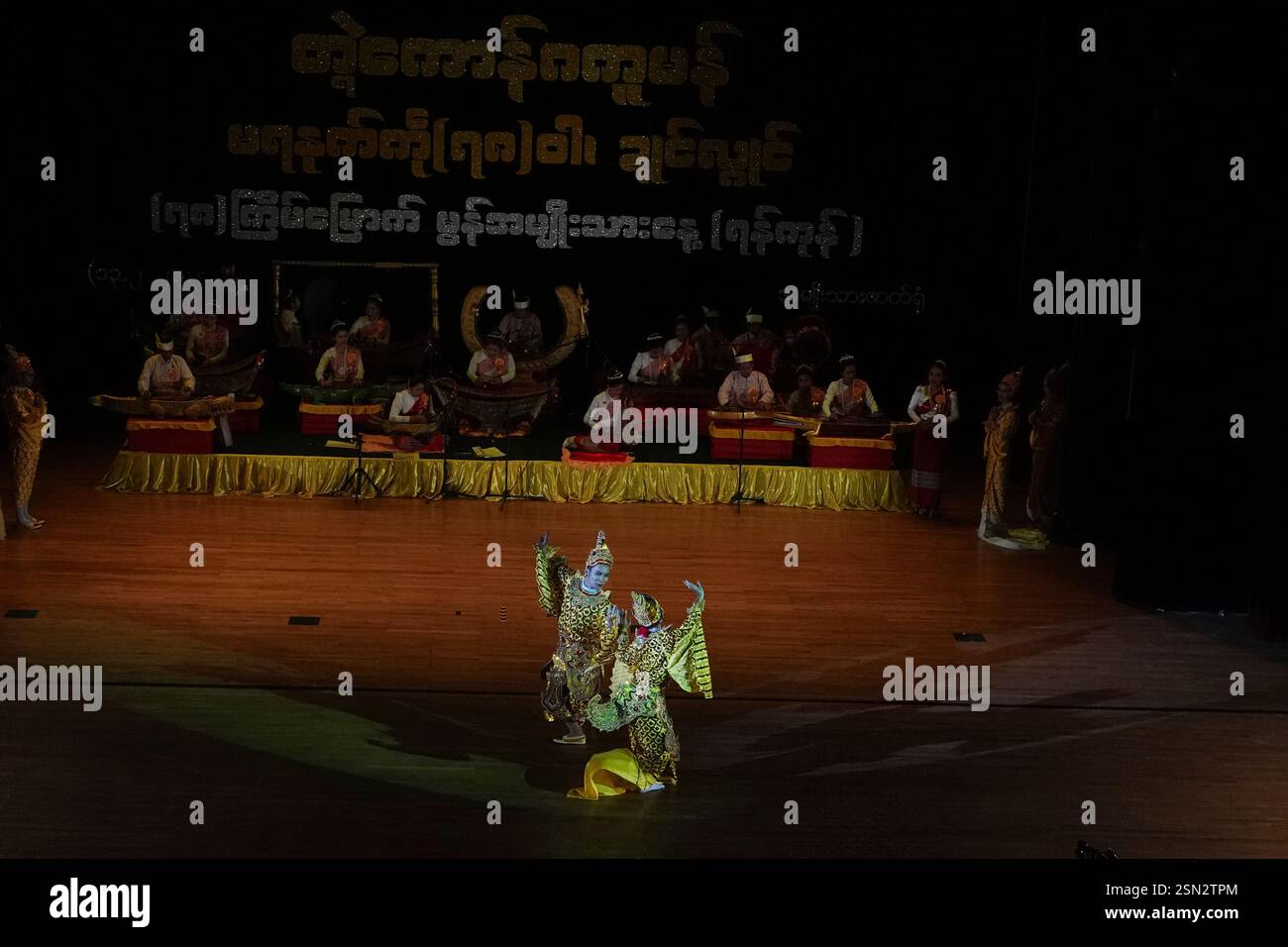 Members of the Mon tribe's artist troupe perform a traditional dance ...