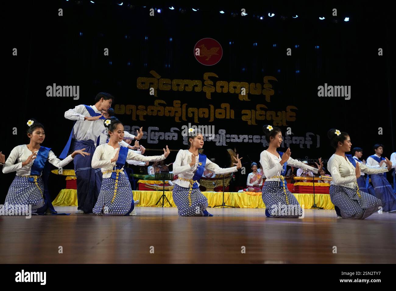 Members of the Mon tribe's artist troupe perform a traditional dance ...
