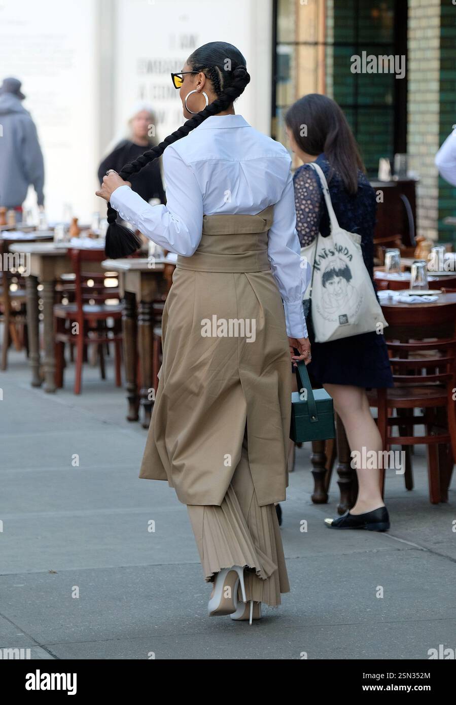 Actress Tessa Thompson wears an unusual dress and pants combination as ...