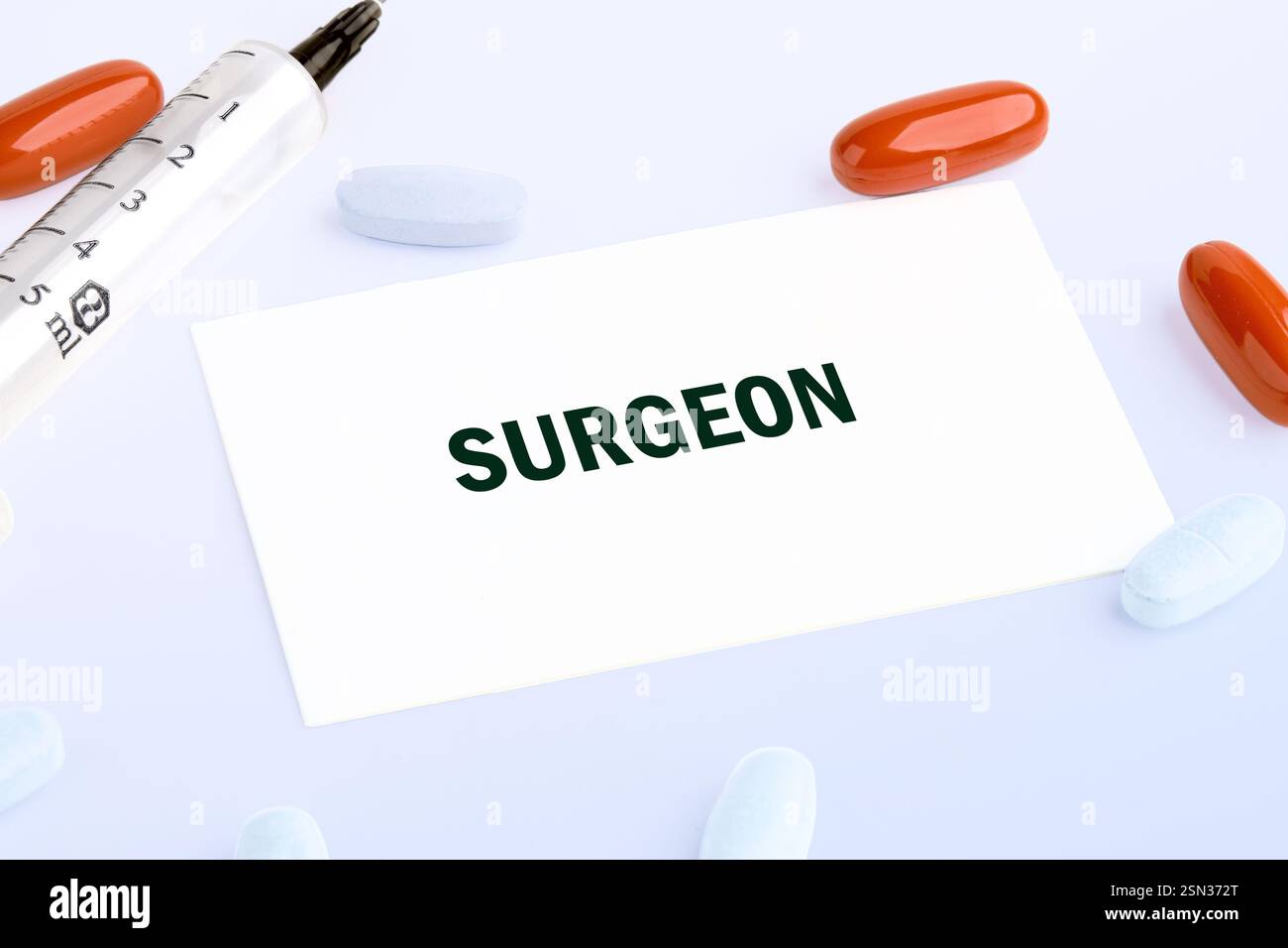 A surgeon's card, syringes, and capsules highlight the professional ...