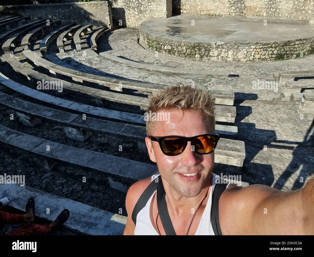 An expressive and vibrant selfie that features a historic theater with ...