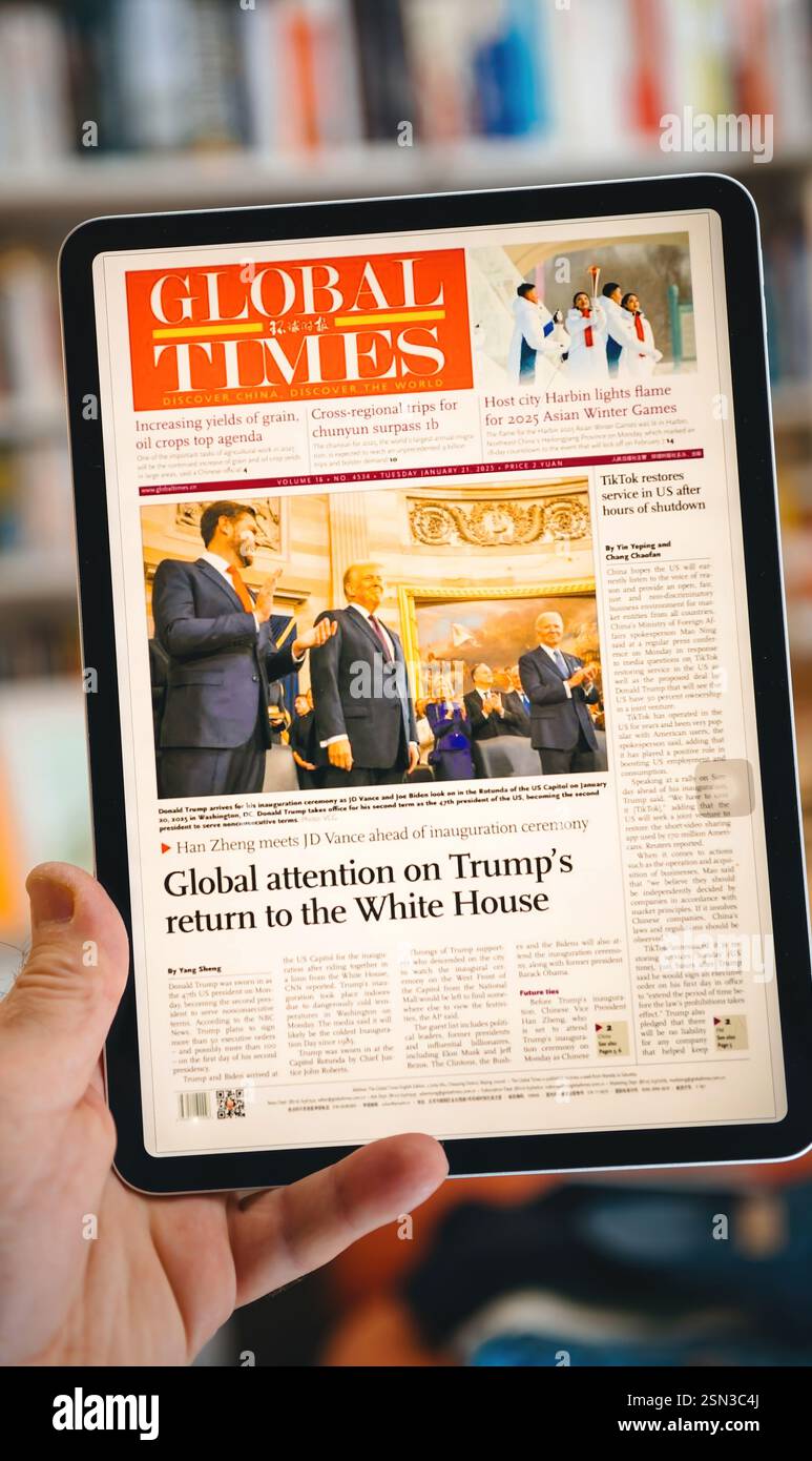 Paris, France - Jan 21, 2025: A tablet screen shows a digital newspaper ...