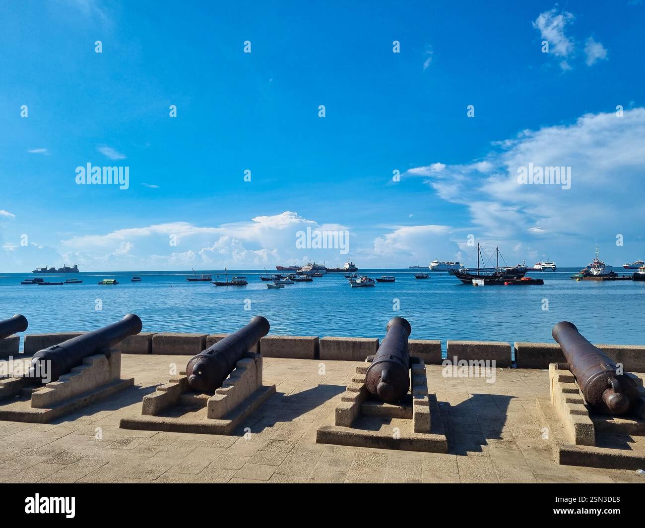 A breathtaking view showcasing historical cannons positioned by the sea ...