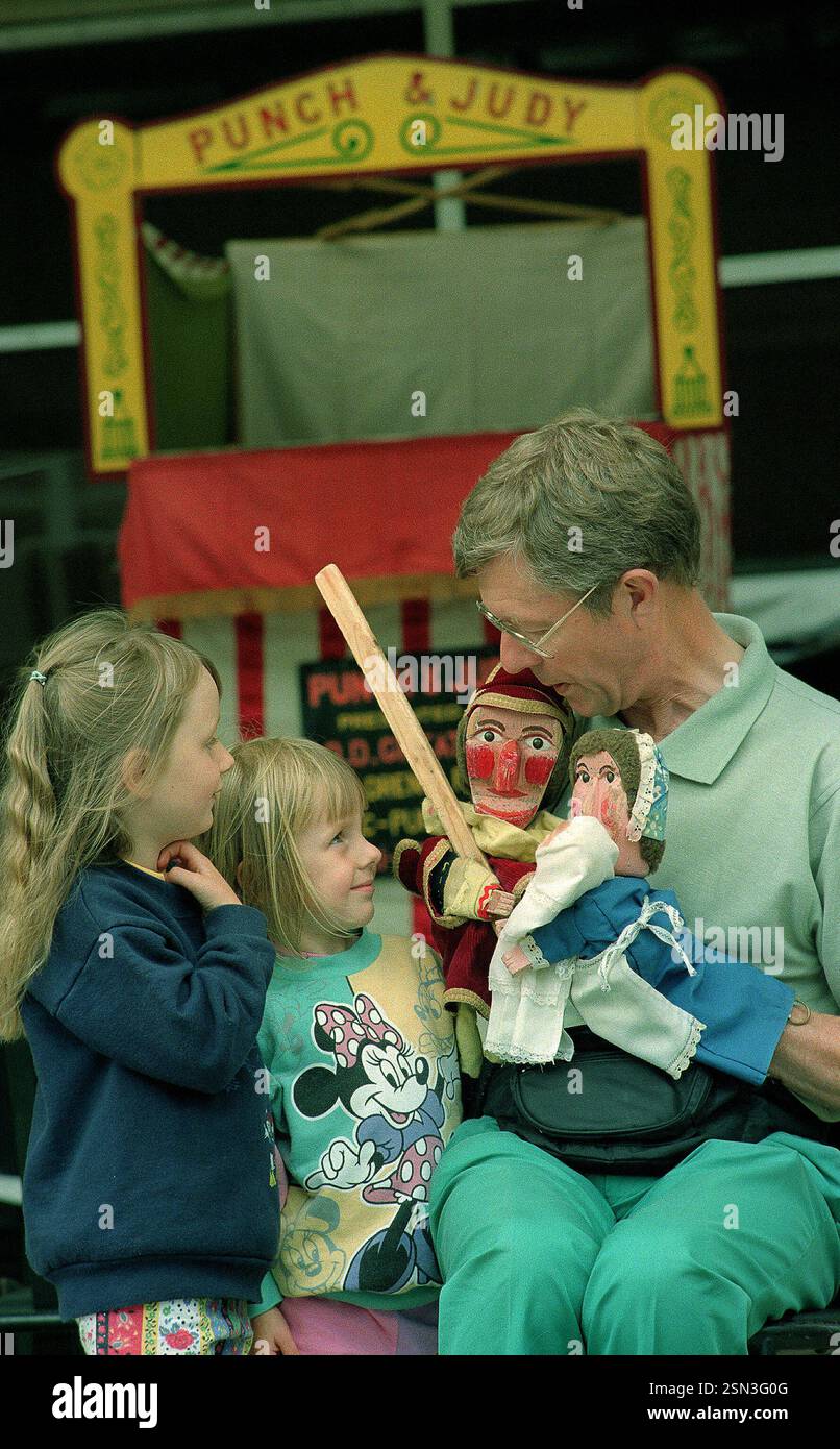 Young children meet Punch & Judy with their operator after watching a ...
