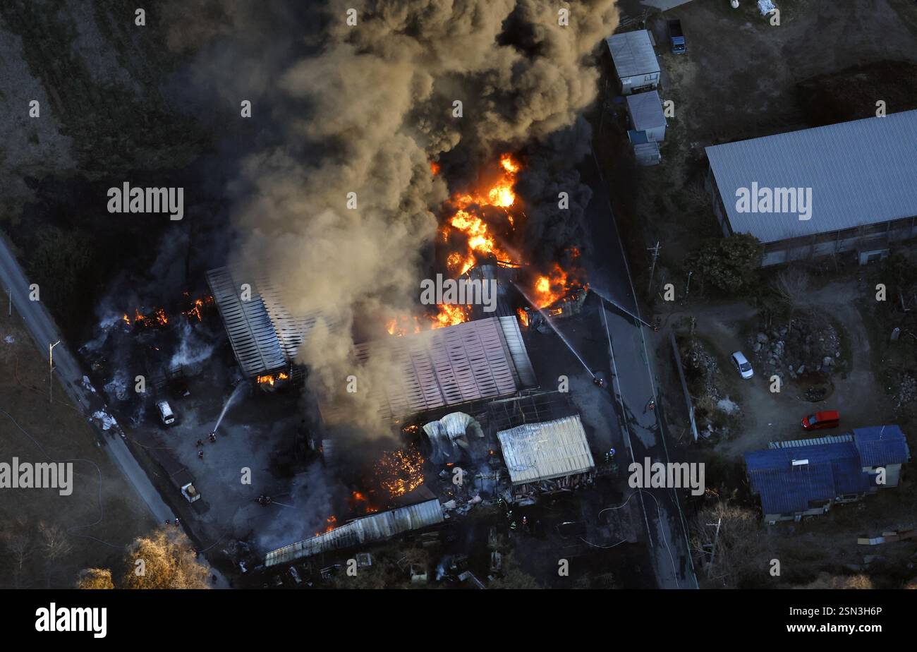 Photo taken from a Kyodo News helicopter shows smoke rising from ...