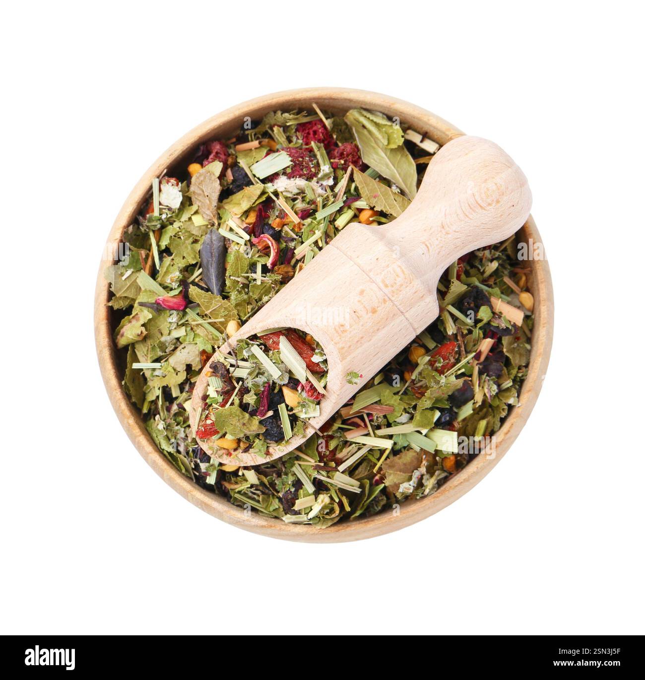 Dry herbal tea brew in bowl with scoop isolated on white, top view ...