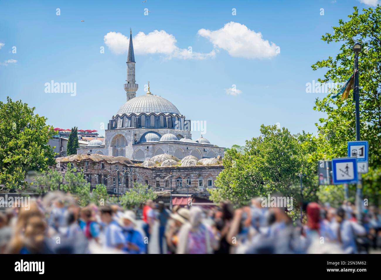 Blurred Crowd of tourists in Istanbul with Ottoman mosque in the ...